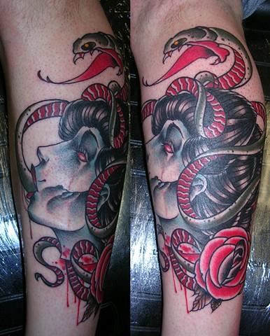 Snake and severed head by Derek Noble: TattooNOW