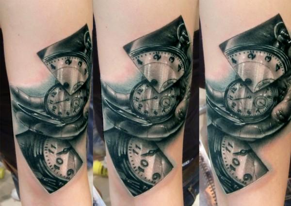 Watch in hand tattoo by George Mavridis: TattooNOW