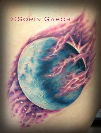 Realistic color moon and space tattoo on ribs by Sorin Gabor: TattooNOW